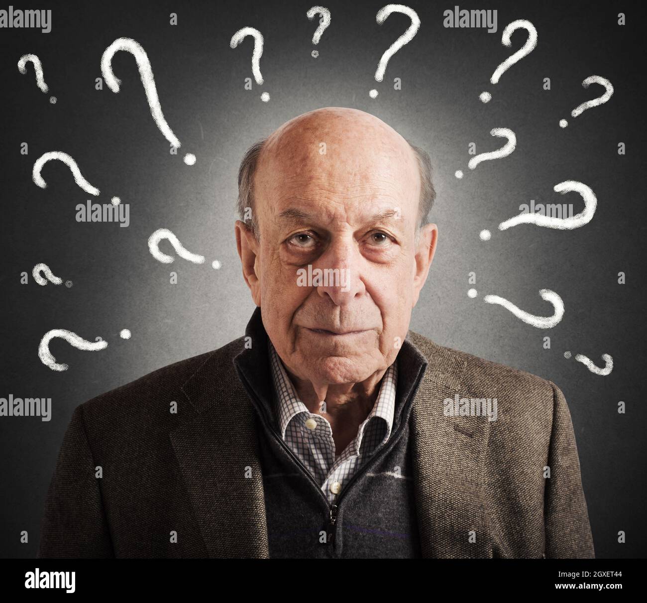 Old man confused with many question marks Stock Photo - Alamy