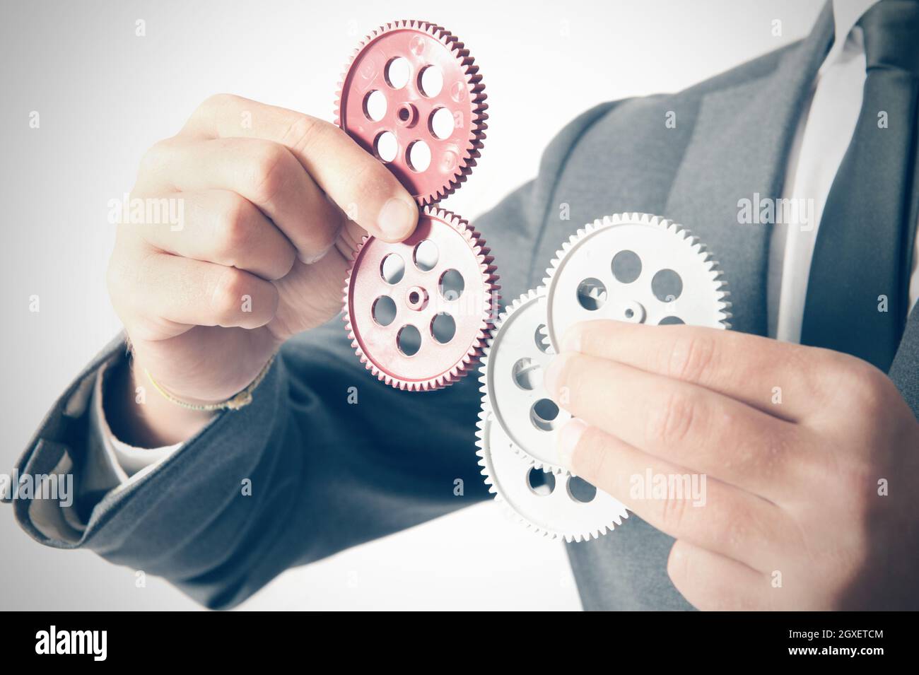 Teamwork concept with gear Stock Photo - Alamy