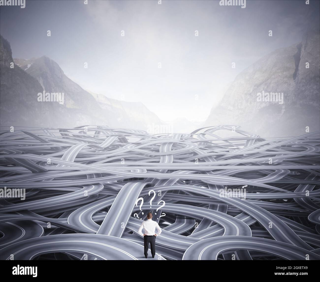 Concept of a businessman in front of a confusion of road Stock Photo ...