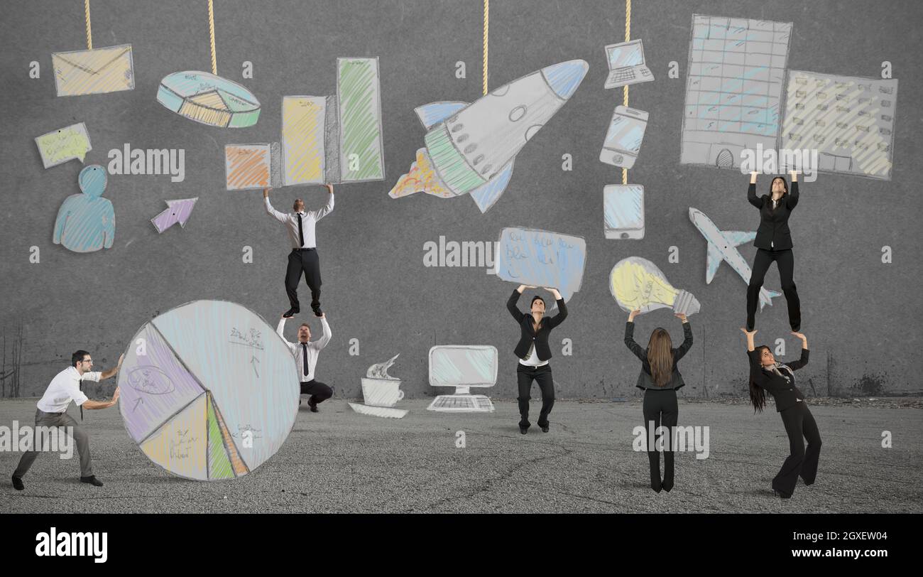 Teamwork builds a new creative business project Stock Photo - Alamy