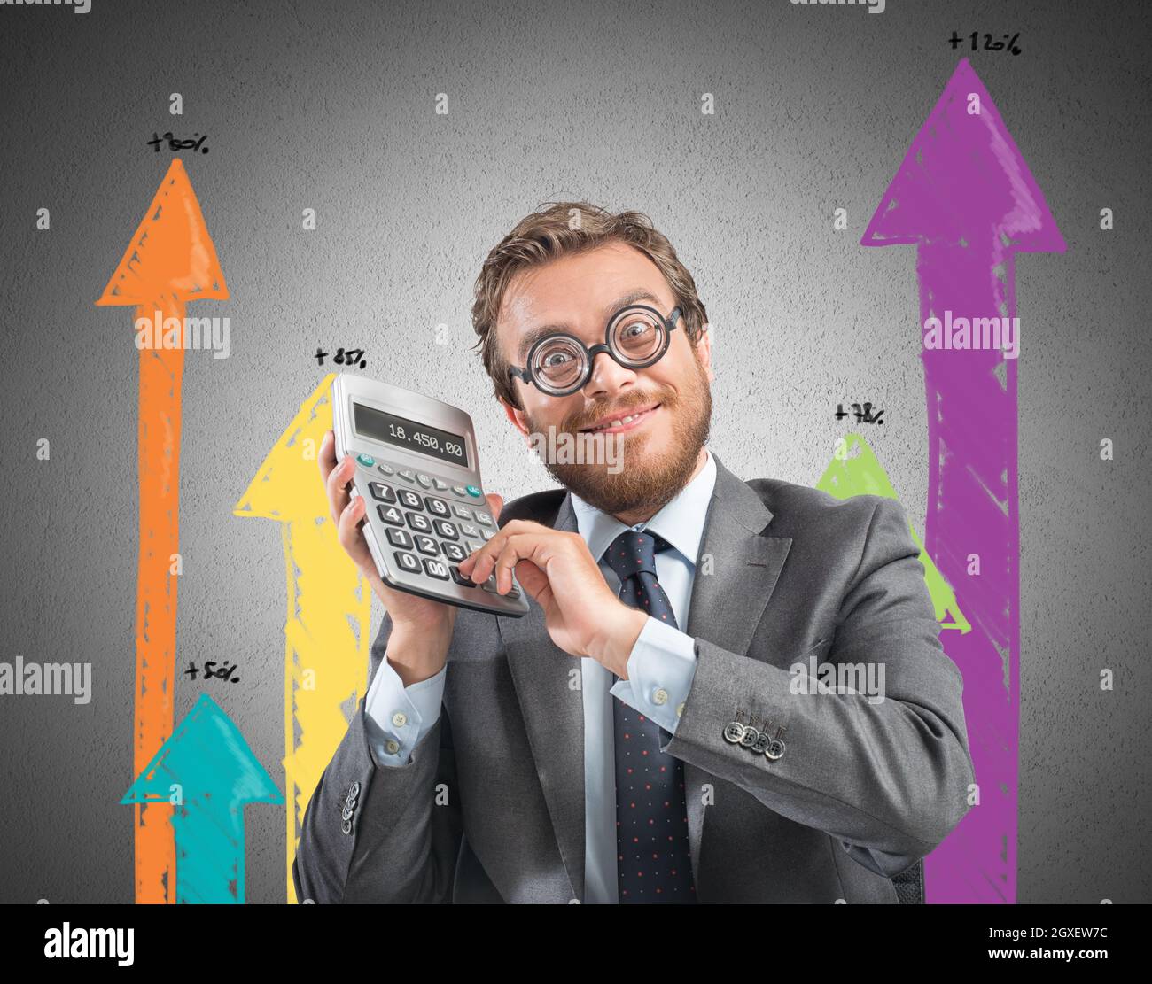 Successful businessman with a calculator and positive statistics Stock ...