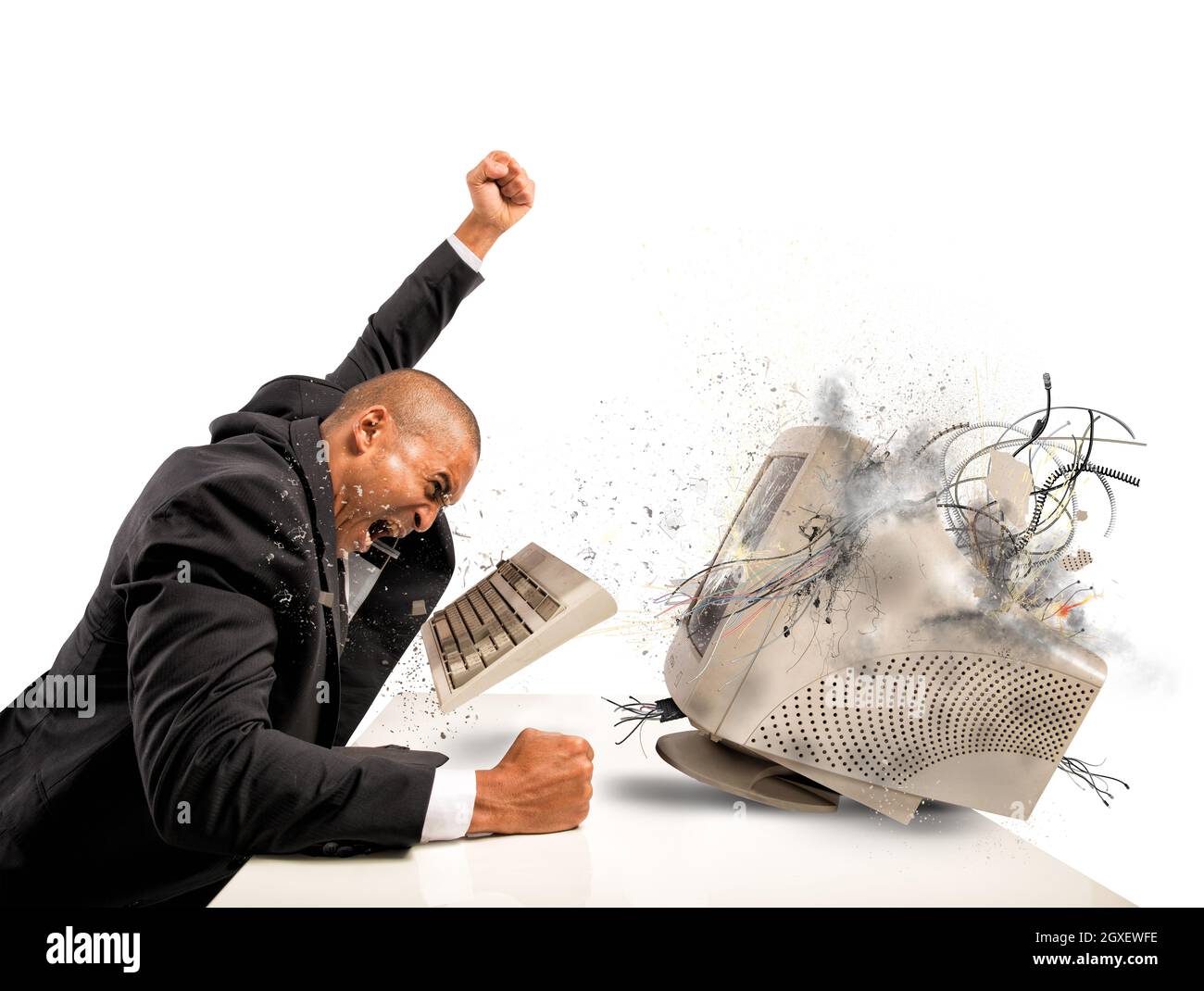 Businessman who breaks furiously an old computer Stock Photo - Alamy