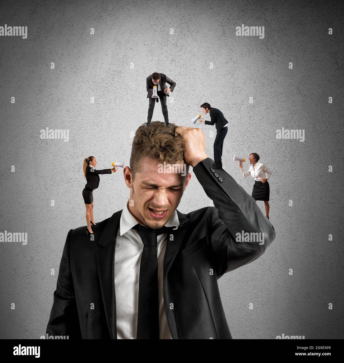 Concept of stress at work with small people shouting with megaphone ...