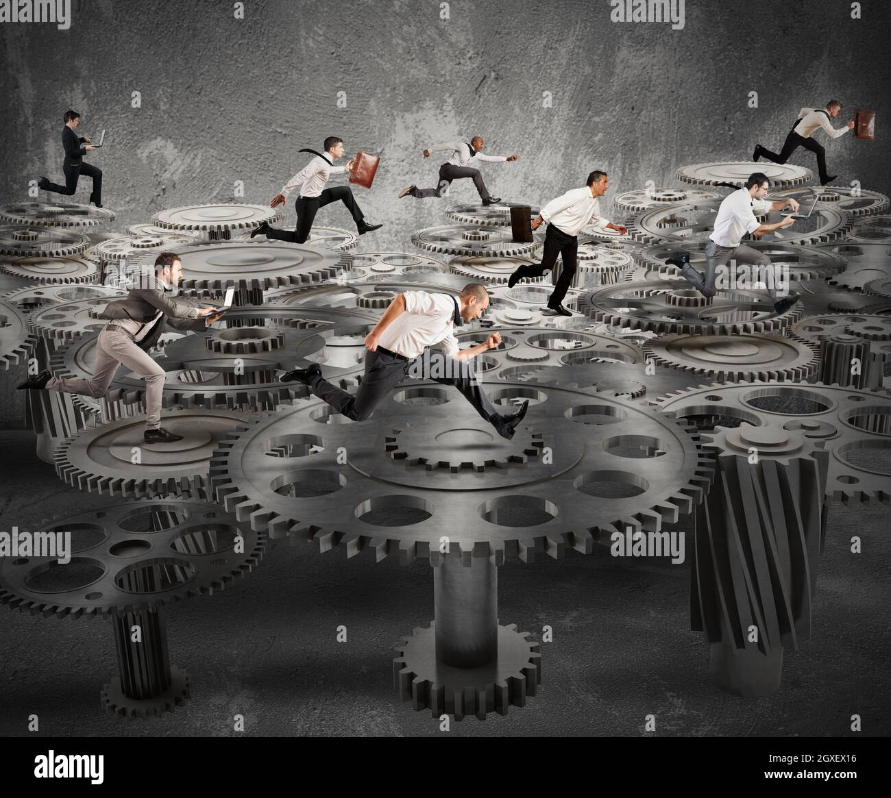 Business people running over a mechanism system Stock Photo - Alamy