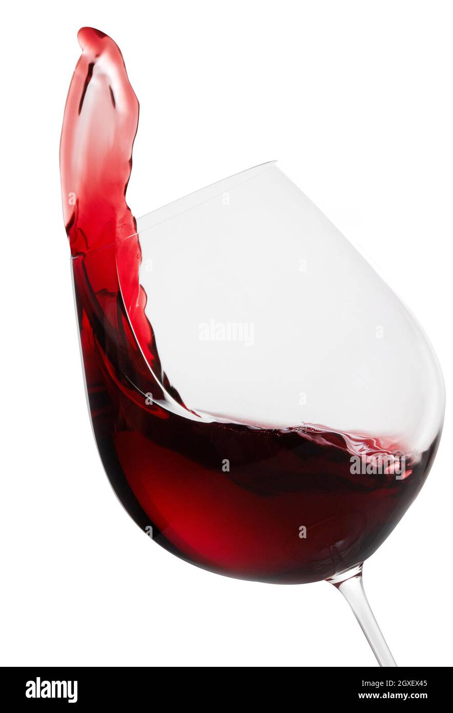 Red wine splashing in a glass on white background Stock Photo - Alamy