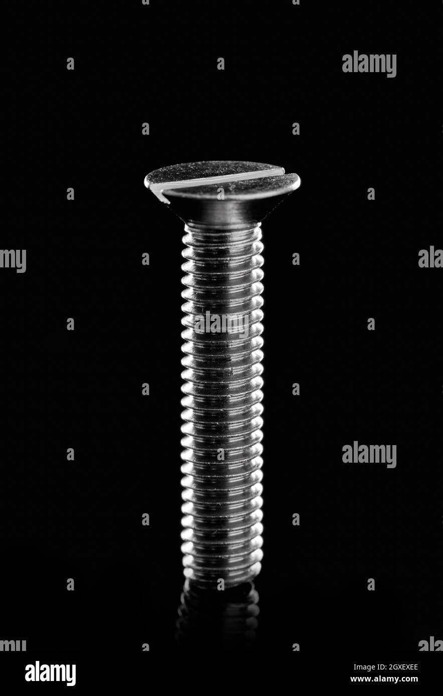 Screw on black background Stock Photo - Alamy
