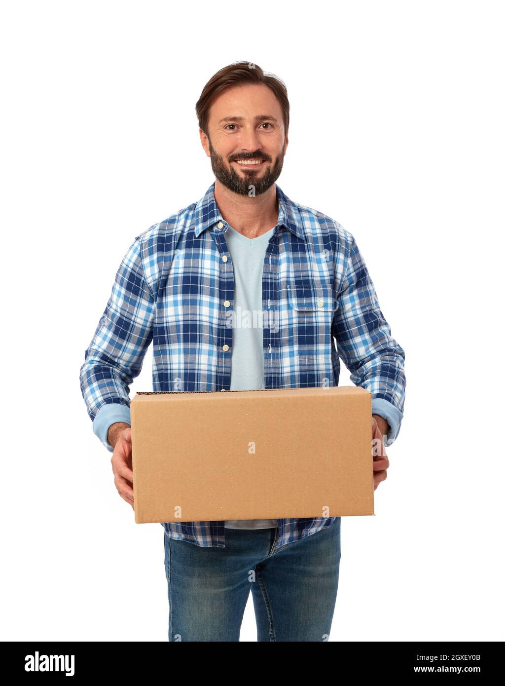 Delivery guy with cardboard box on white background Stock Photo - Alamy