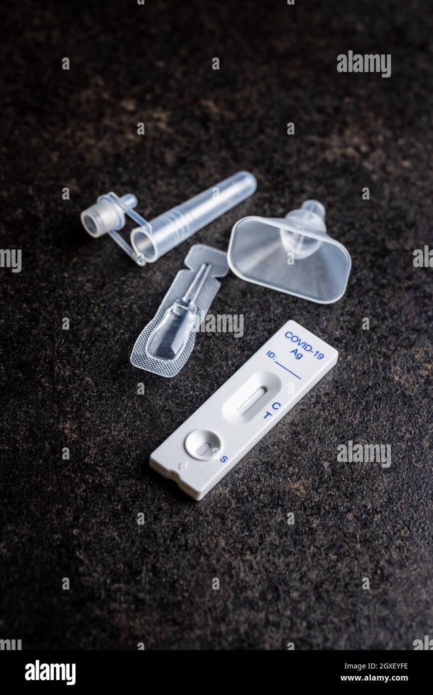 Covid-19 rapid antigen test. Rapid antibodies test kit on black table ...