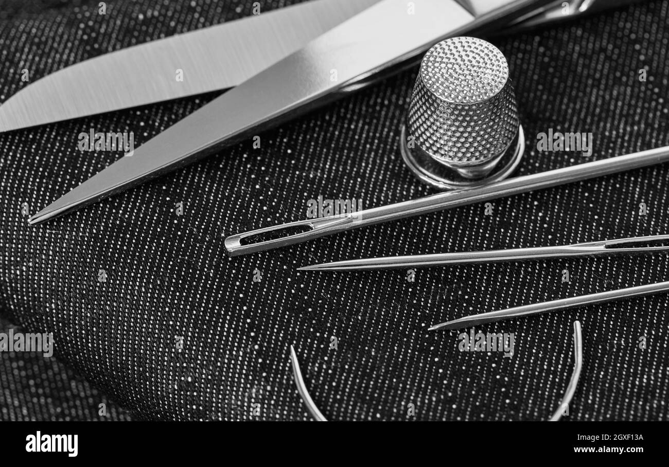Tailoring scissors, needles and textile Stock Photo - Alamy