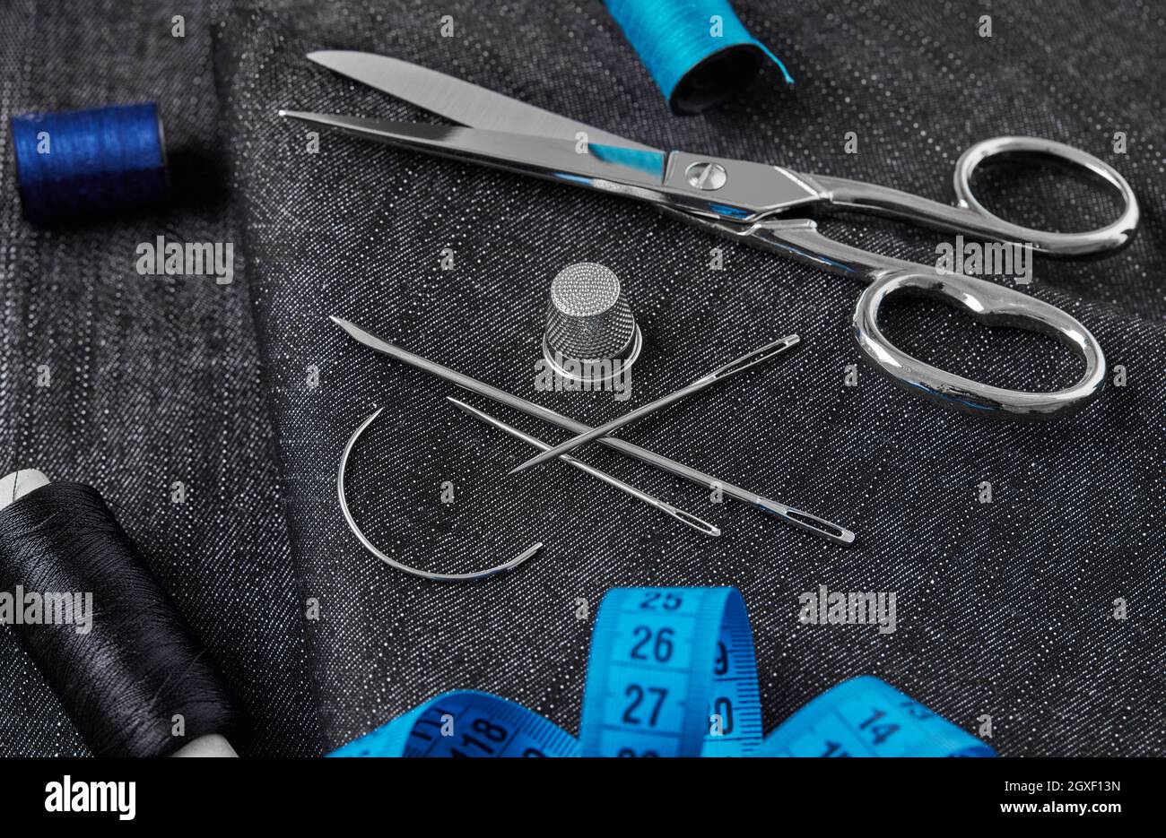 Tailoring thread, scissors, needles, textile and tape measure Stock ...