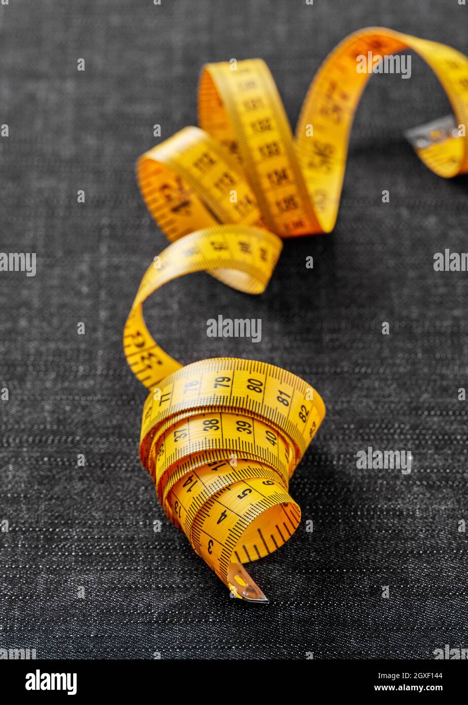 Tape measure on textile Stock Photo - Alamy