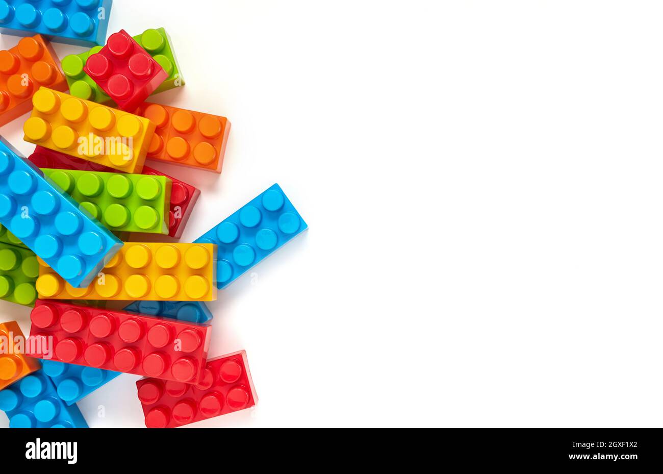 Plastic toy blocks on white background Stock Photo - Alamy