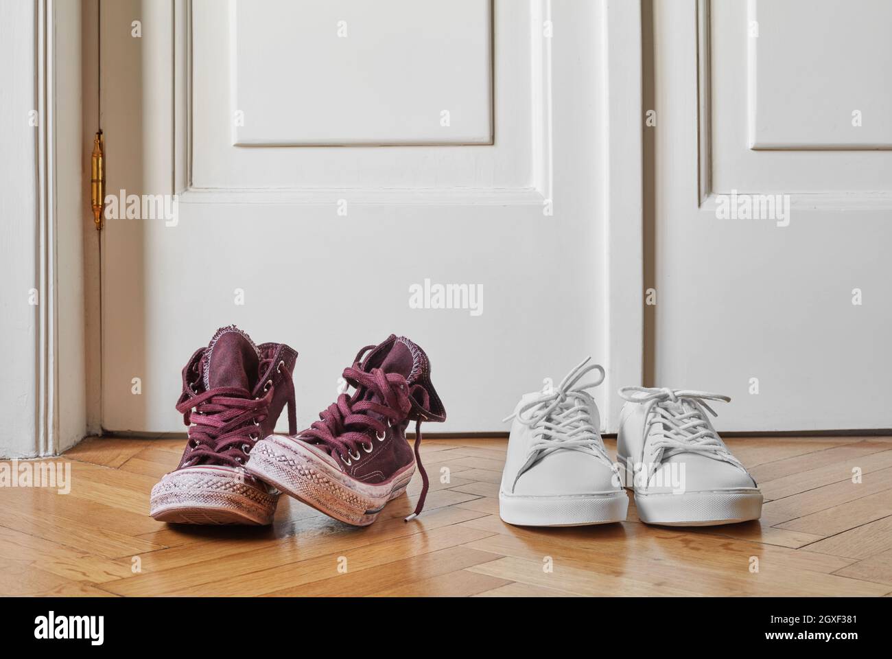 Used and new shoes on floor Stock Photo - Alamy