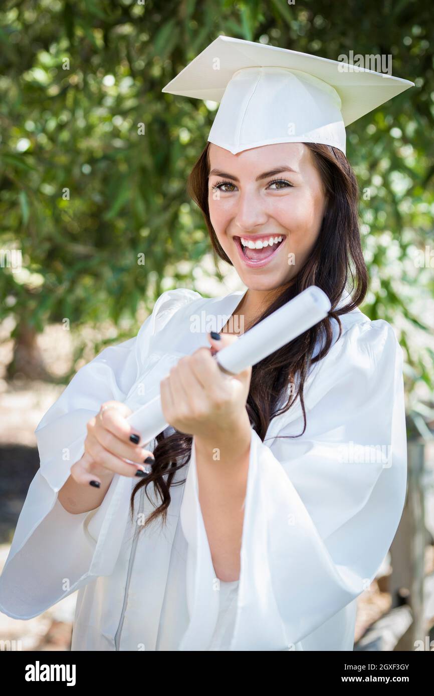 Attractive Mixed Race Girl Celebrating Graduation Outside In Cap and ...