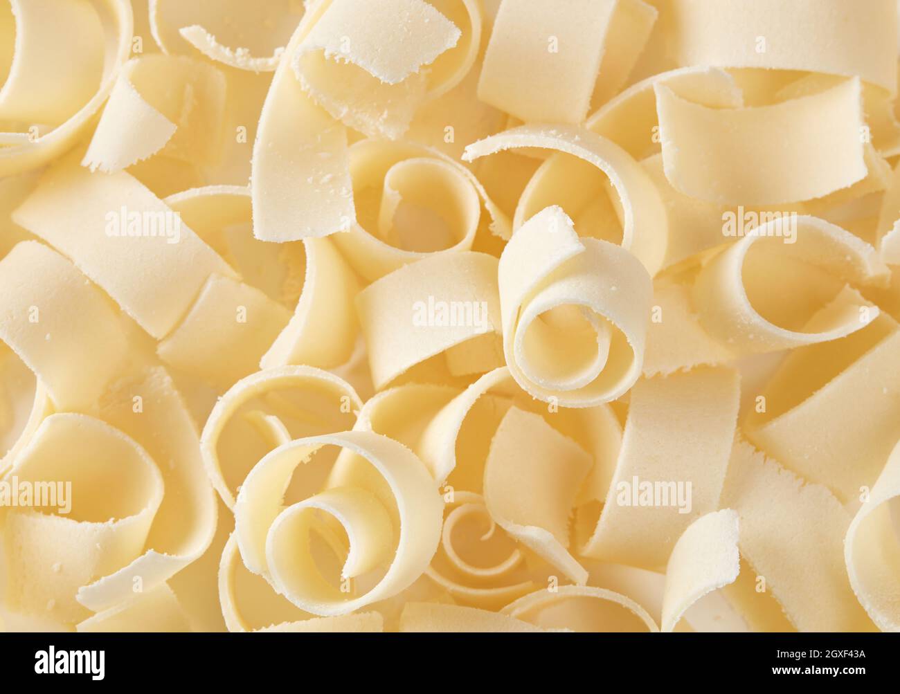 White chocolate flakes background Stock Photo - Alamy