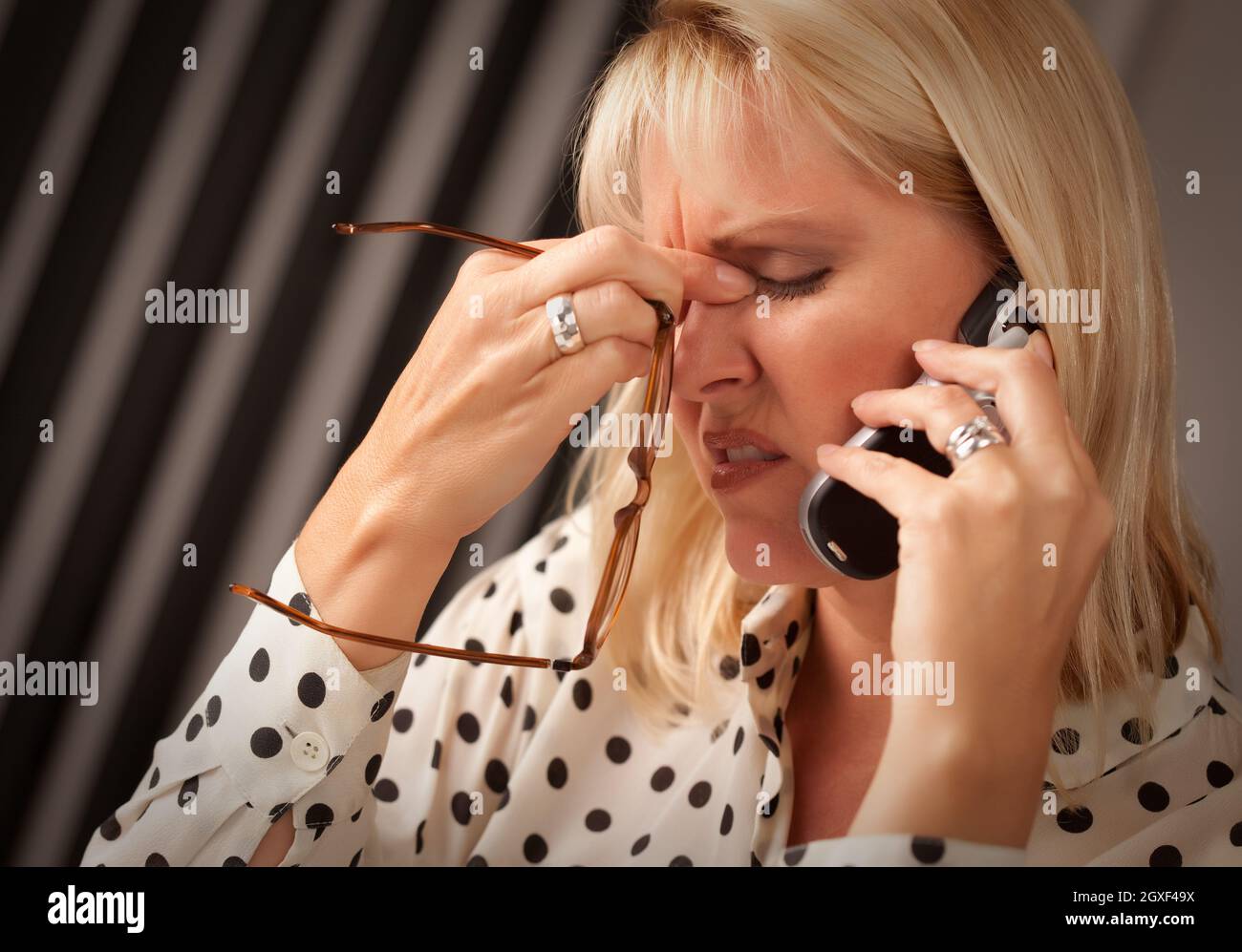 Blonde Woman on Her Cell Phone with Stressed Look on Her Face Stock ...