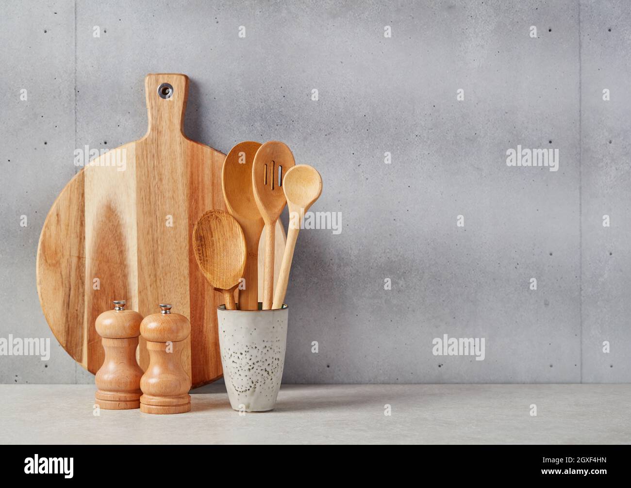 Kitchen utensils on concrete countertop Stock Photo - Alamy