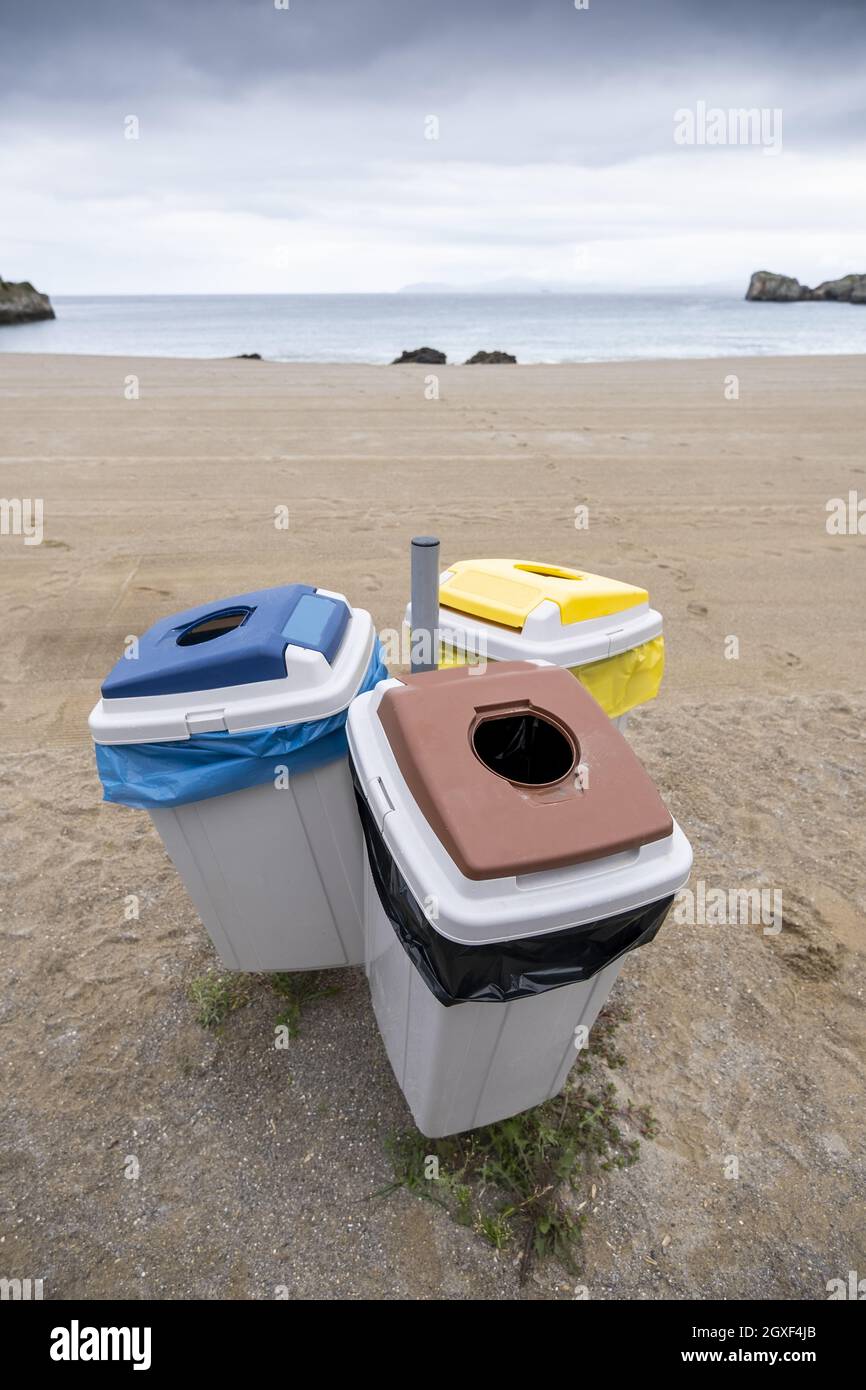 Cleaning and recycling detail on the beach, caring for the environment ...