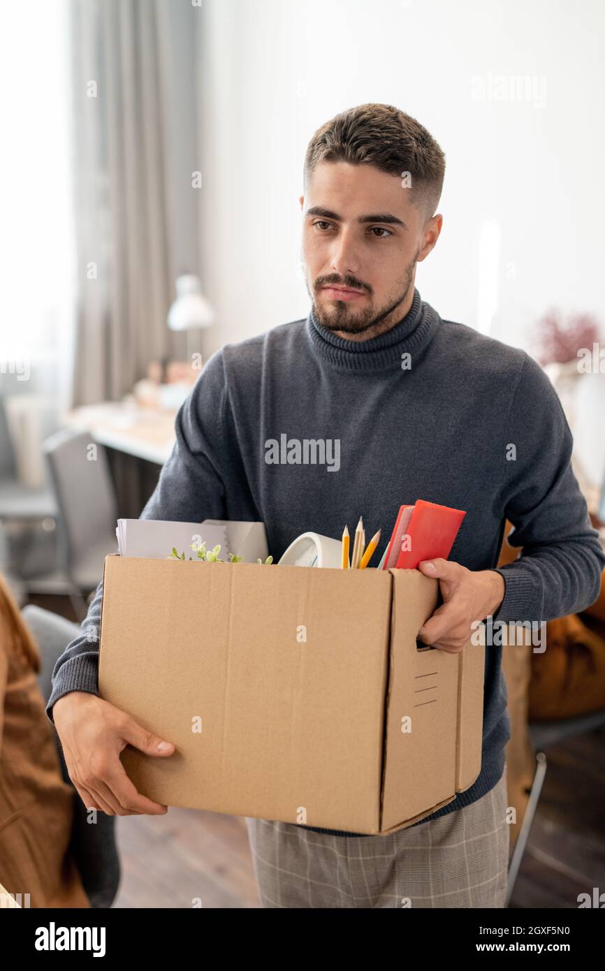 Businessman carrying box supplies hi-res stock photography and images ...