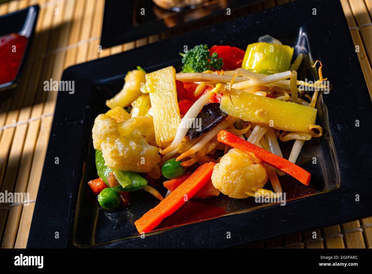 Fried vegetables from the wok with deep fried meat Stock Photo - Alamy