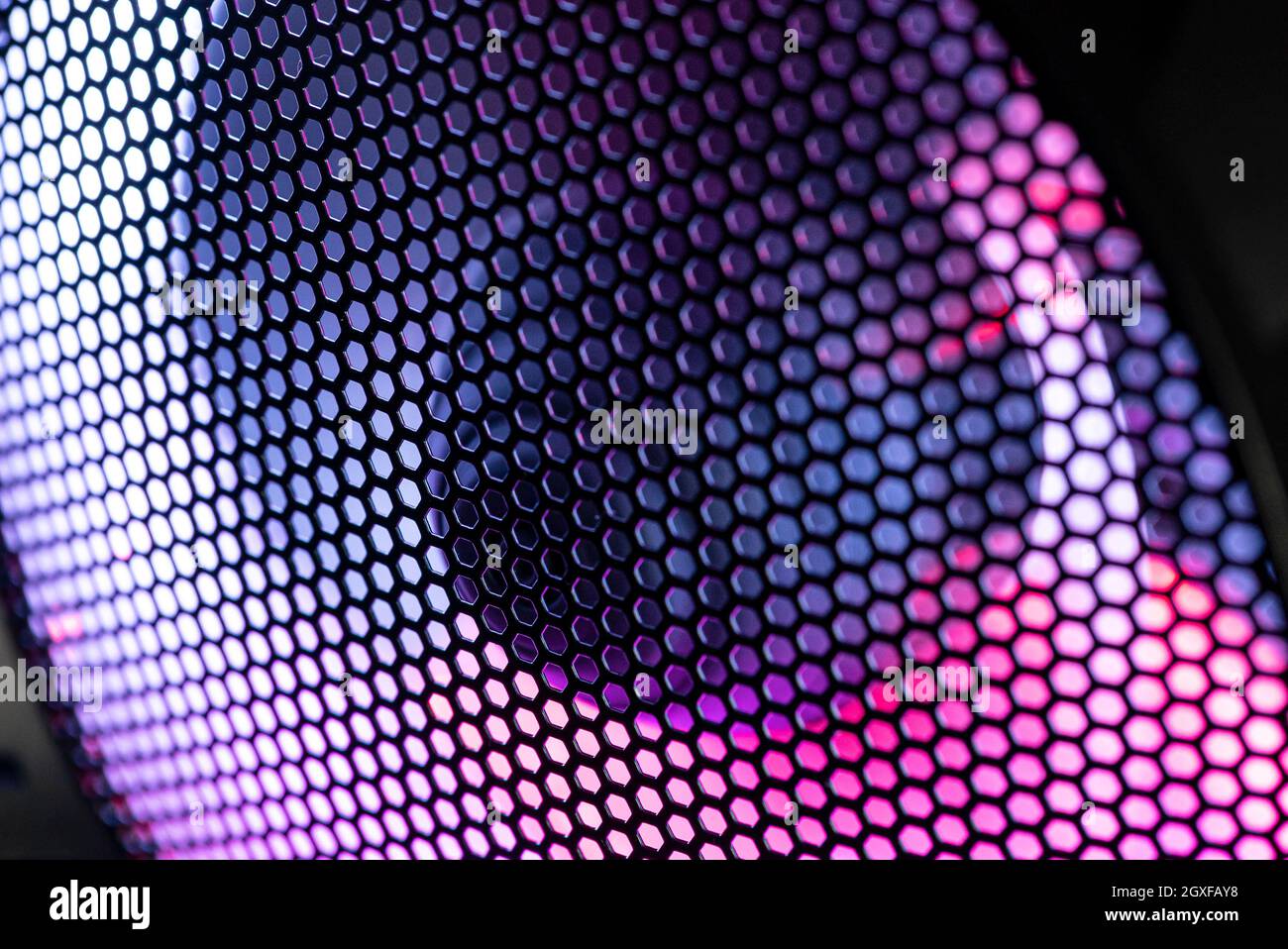Detail of the case of a gaming pc with fan illuminated by rgb led and ...