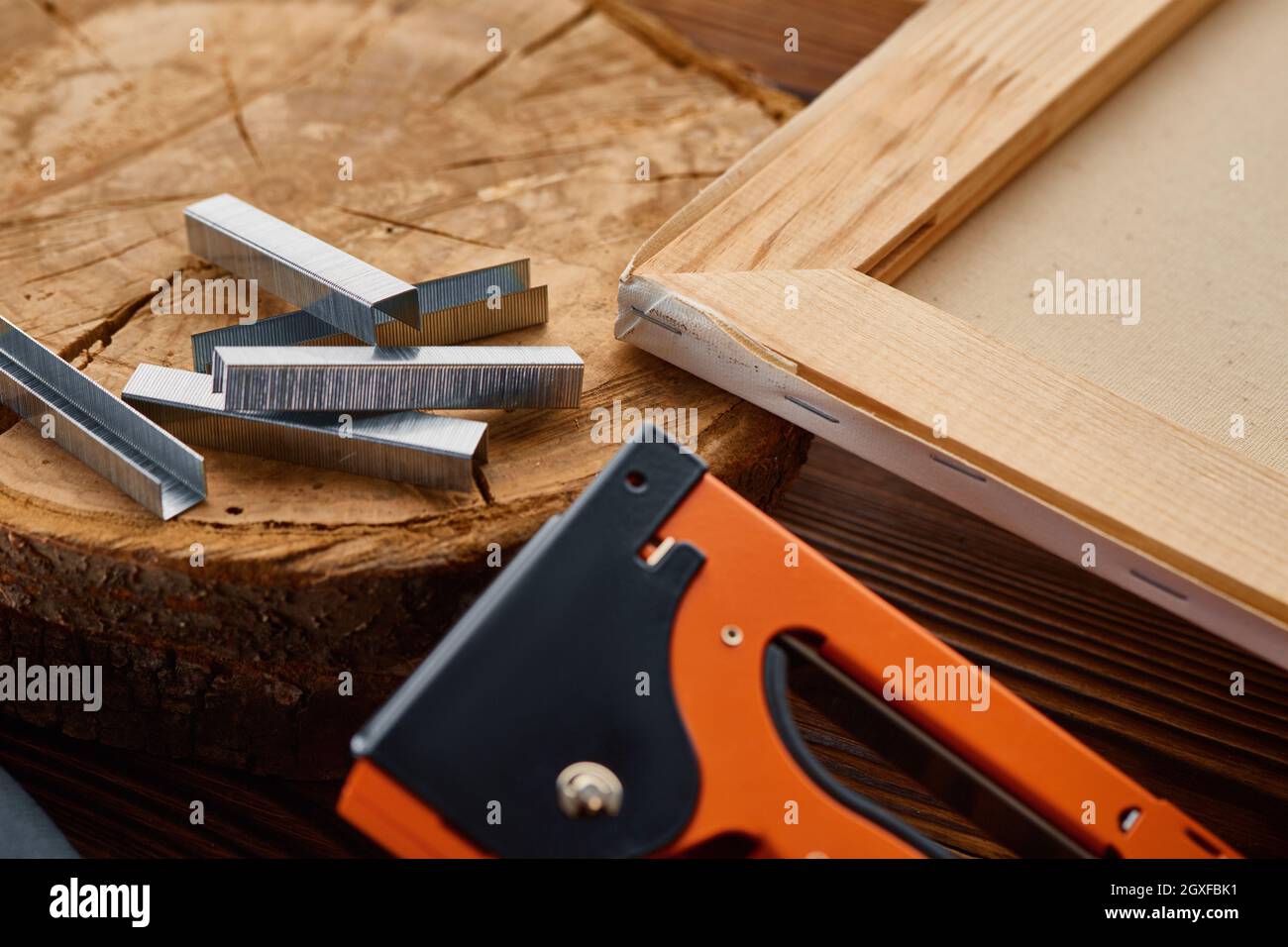 Stapler and staples on stump, macro view, wooden background, nobody ...