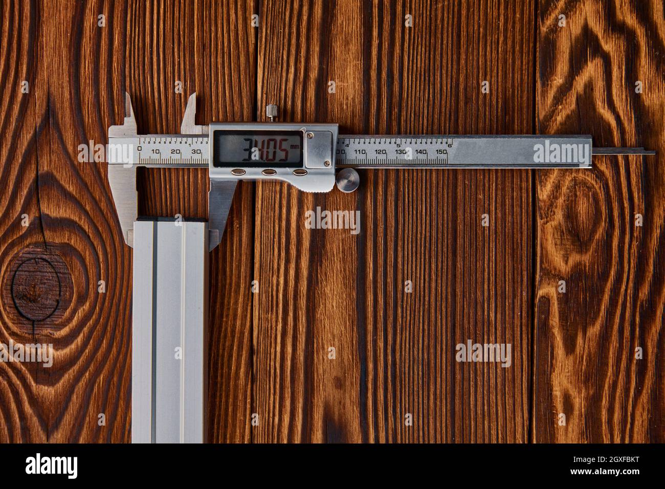 Electronic vernier caliper, wooden background, top view, nobody ...
