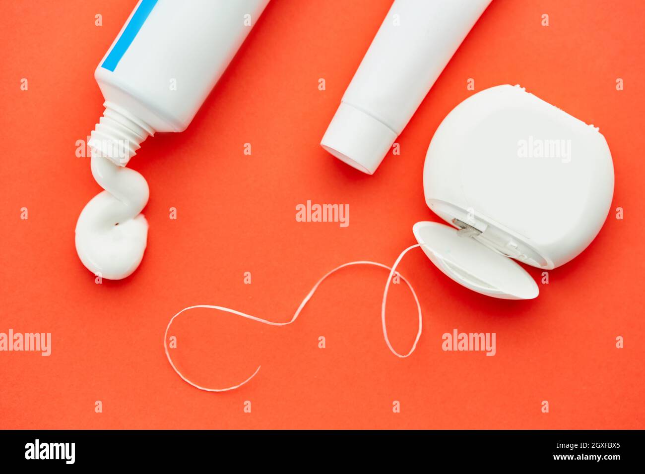 Oral care products, red background, nobody. Morning healthcare ...