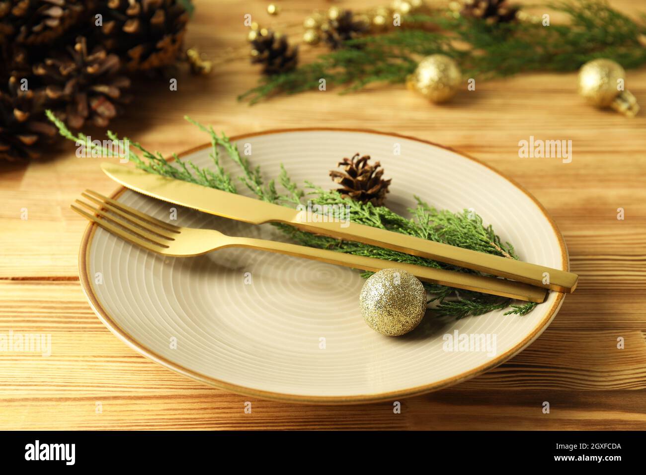 New Year table setting on wooden table Stock Photo - Alamy