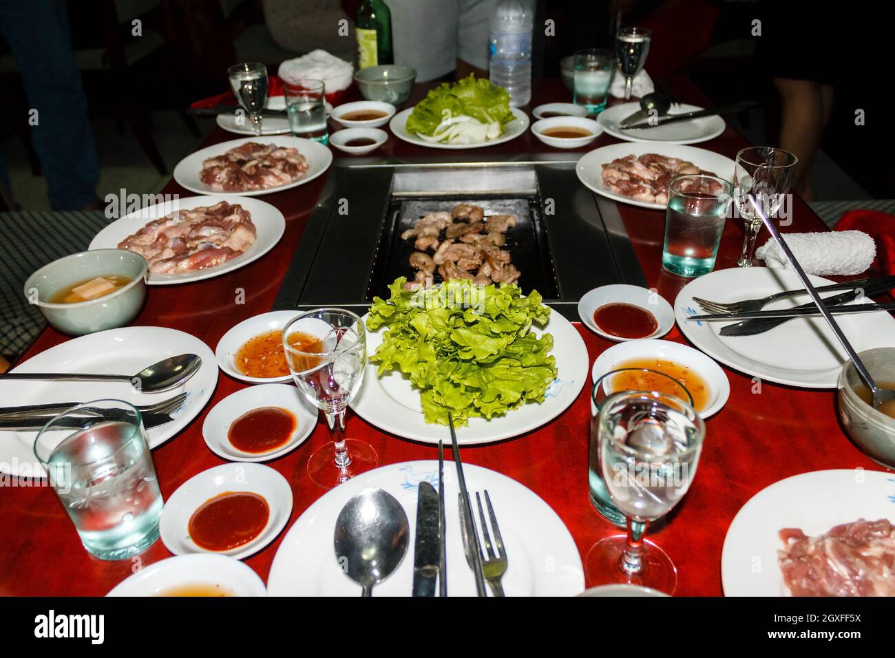Cooking duck meat at a Pyongyang restaurant. Lunch for tourists ...