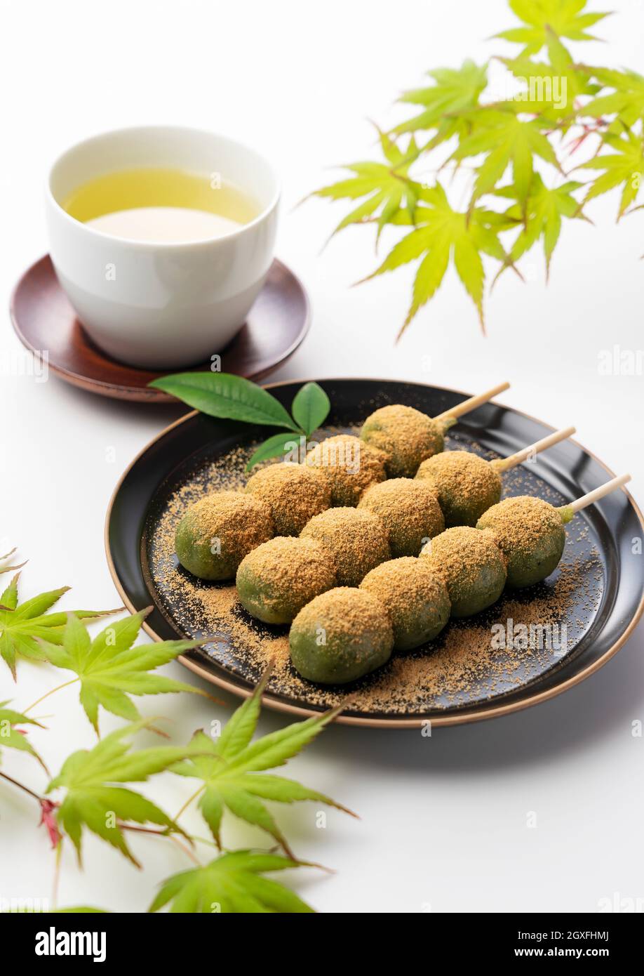 mugwort-flavored rice dumpling covered with soybean flour and green tea ...