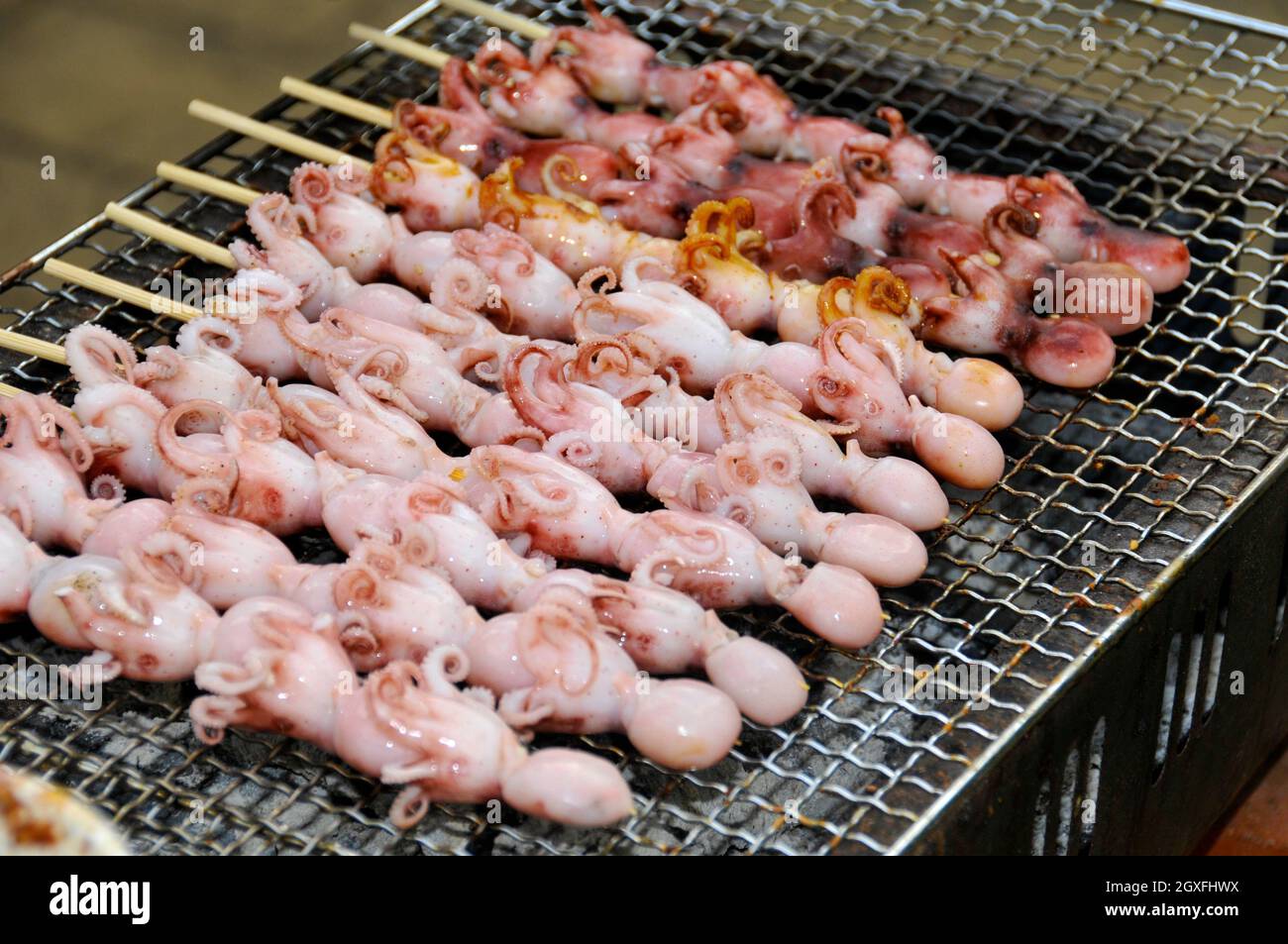 Grilled octopus for sale on the streets of Enoshima, Japan Stock Photo ...