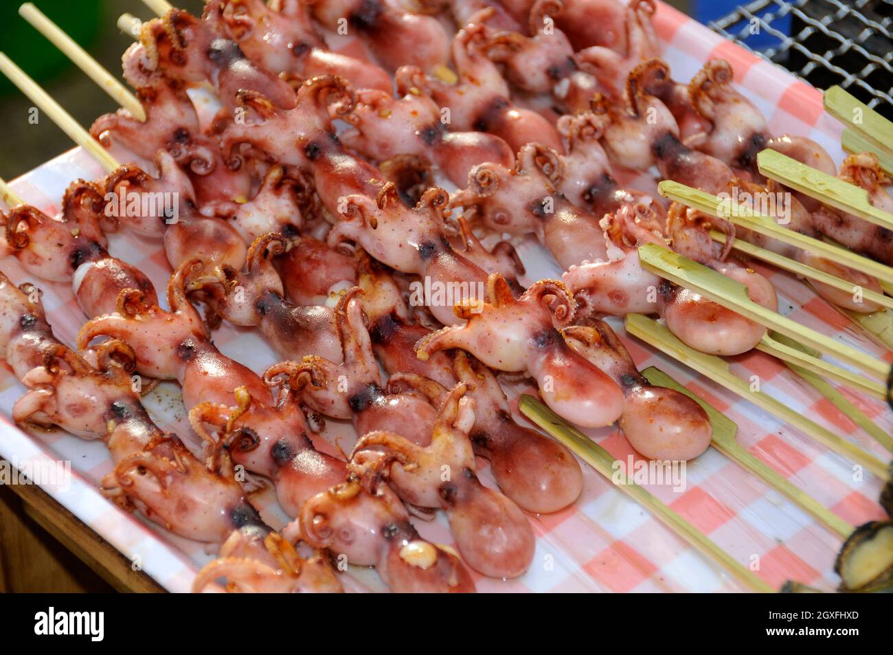 Grilled octopus for sale on the streets of Enoshima, Japan Stock Photo ...