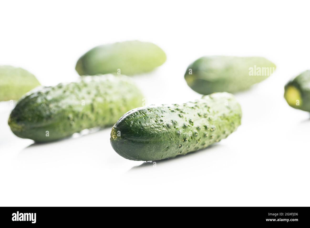 Fresh green cucumbers isolated on white background Stock Photo - Alamy