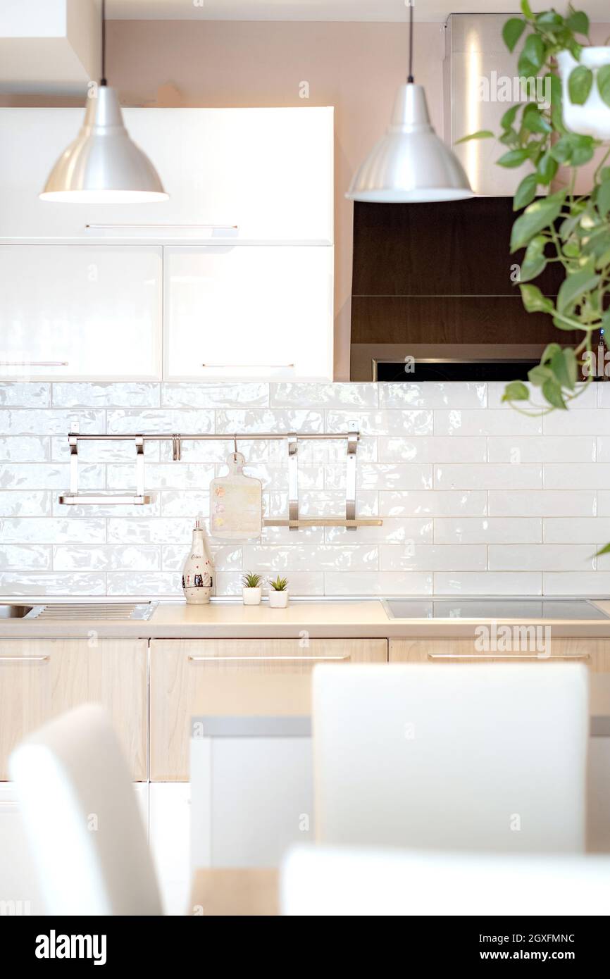 View of a modern white kitchen interior vertical orientation Stock ...