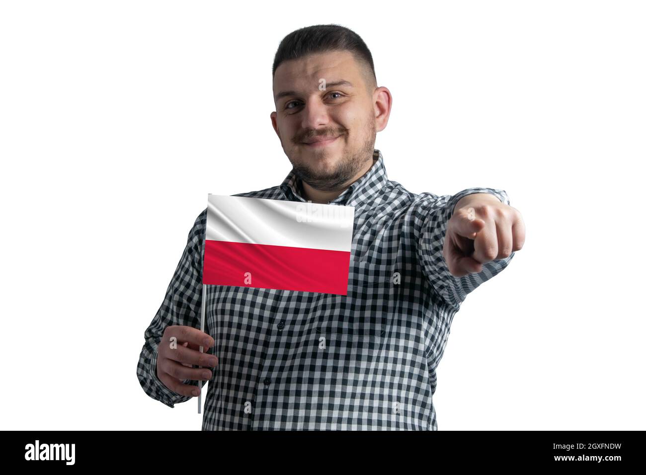 White guy holding a flag of Poland and points forward in front of him ...