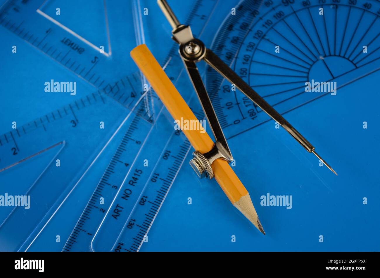 A math set consisting a compass and protractor and rulers and angles ...