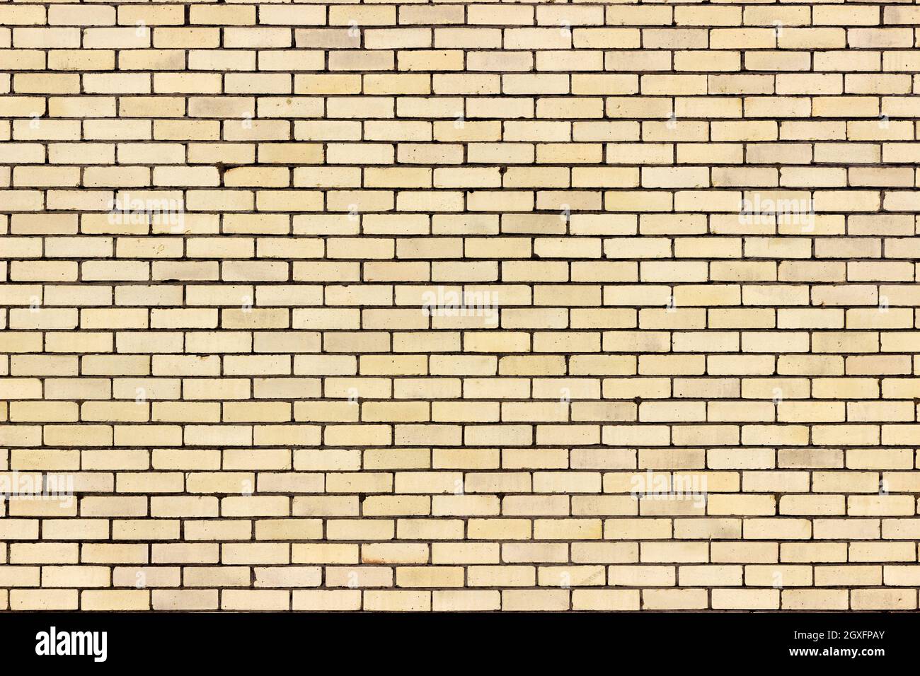 A light yellow sand colour brick wall from a distance Stock Photo - Alamy