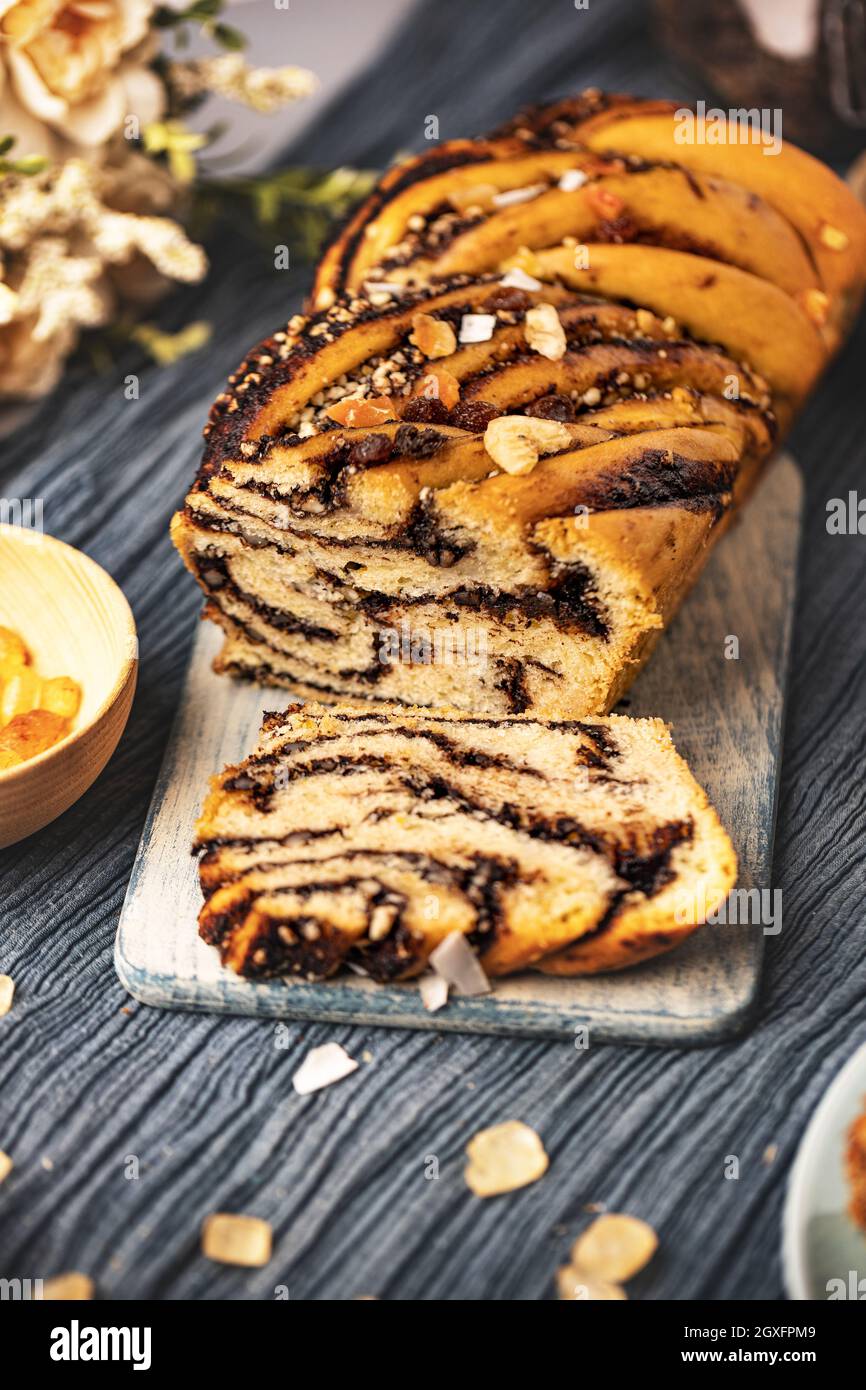 Traditional Polish vegan babka cake with chocolate on wooden background ...