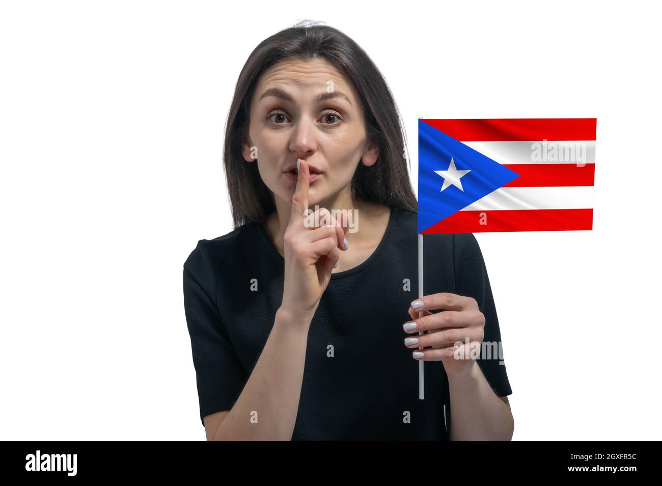 Happy young white woman holding flag of Puerto Rico and holds a finger ...