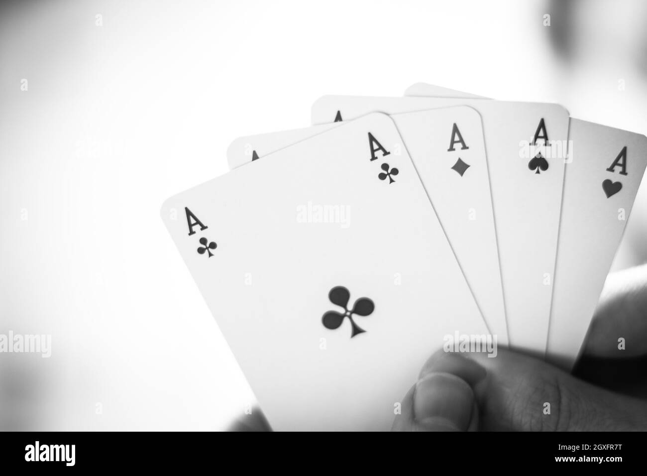 Hand holding playing card Black and White Stock Photos & Images - Alamy