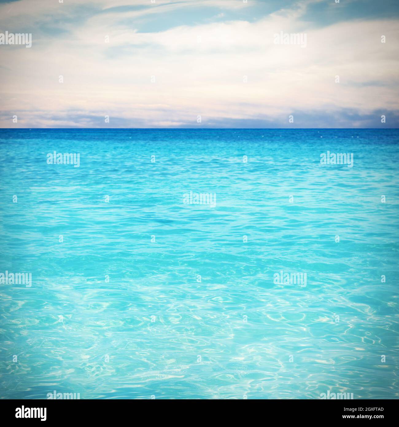 Background crystal clear sea with sunny sky Stock Photo - Alamy