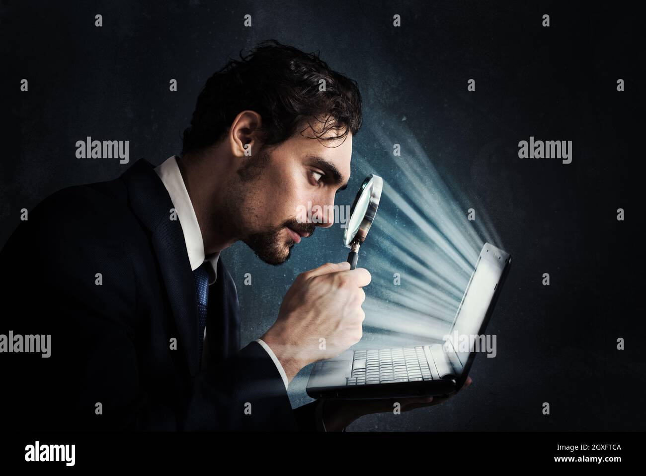 Businessman look with magnifying glass at the computer screen Stock ...