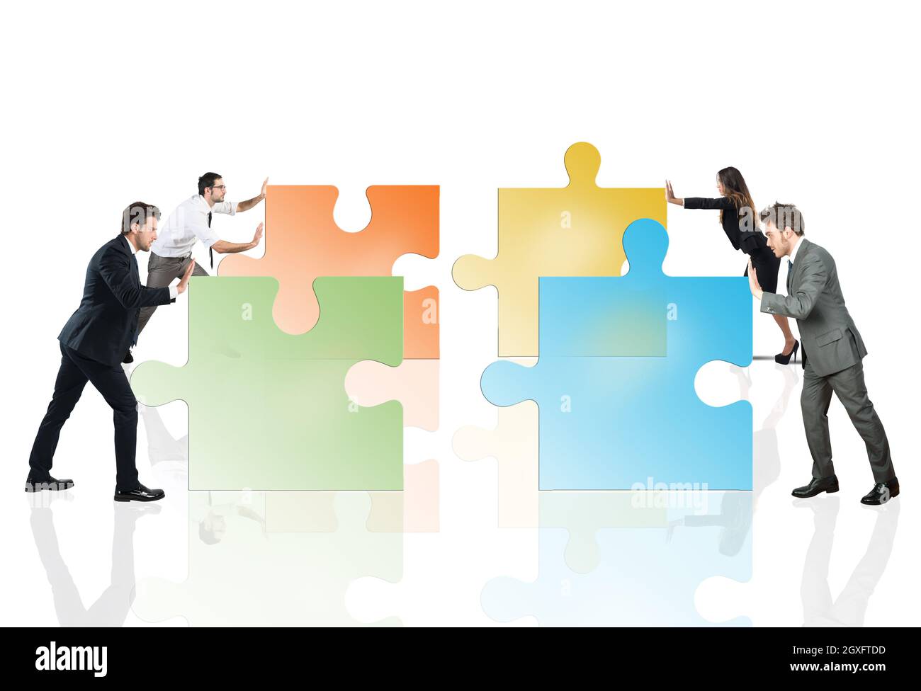 Concept of teamwork and partnership. Businesspeople pushing pieces of ...