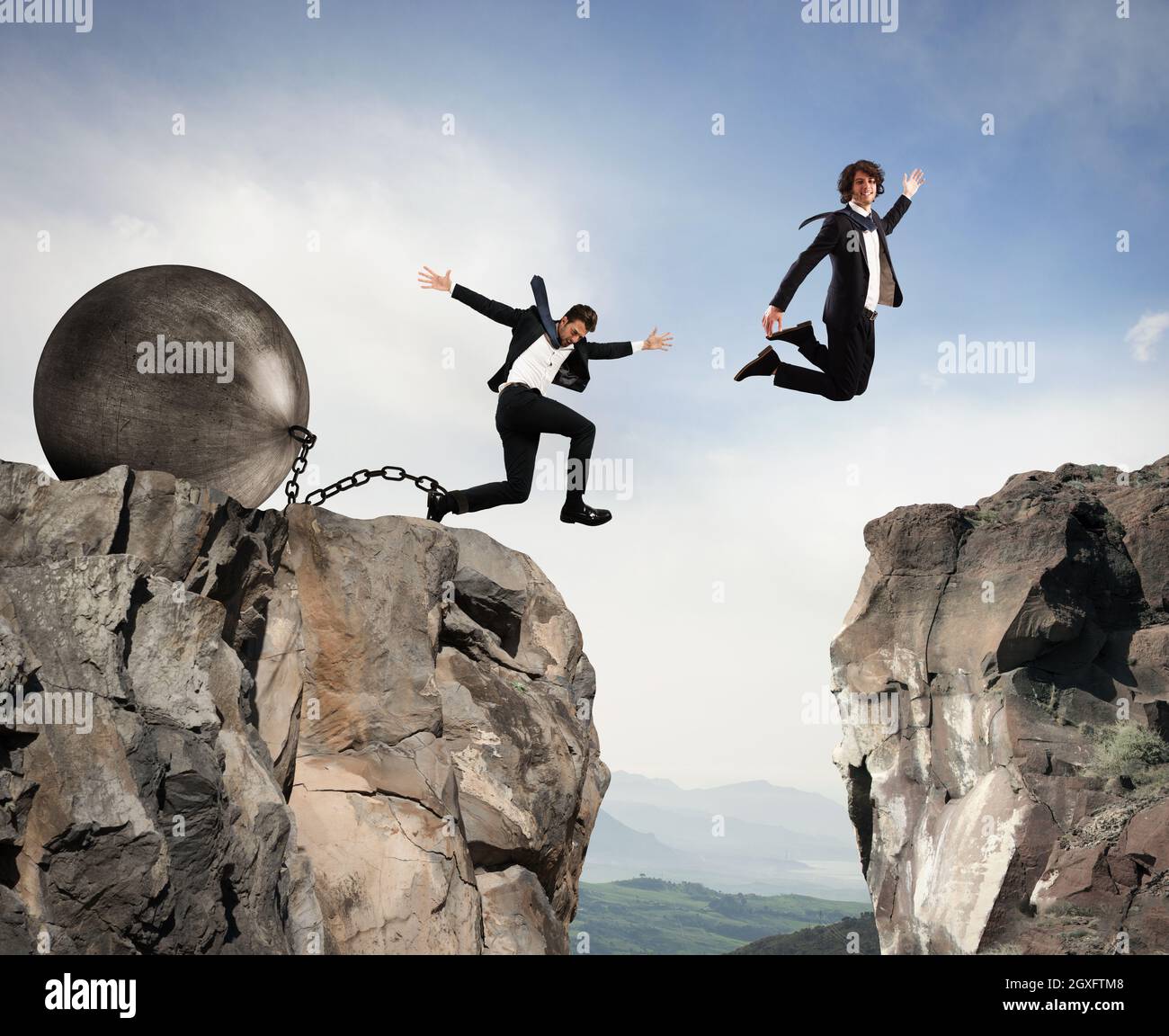 Man jumps between two mountains before the man with a heavy ball ...