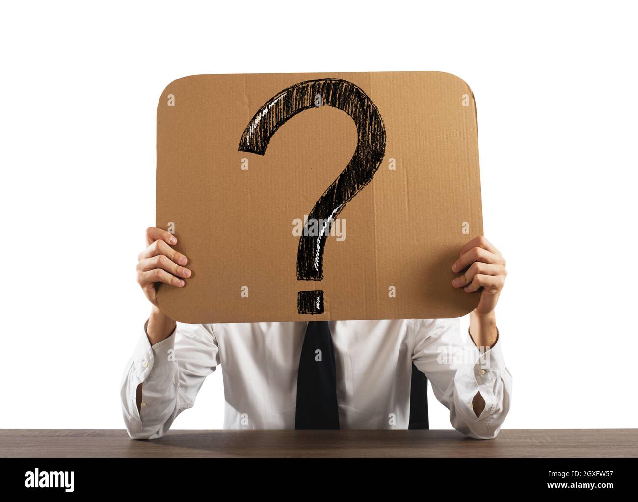 Businessman in the office holds a cardboard with big question mark ...