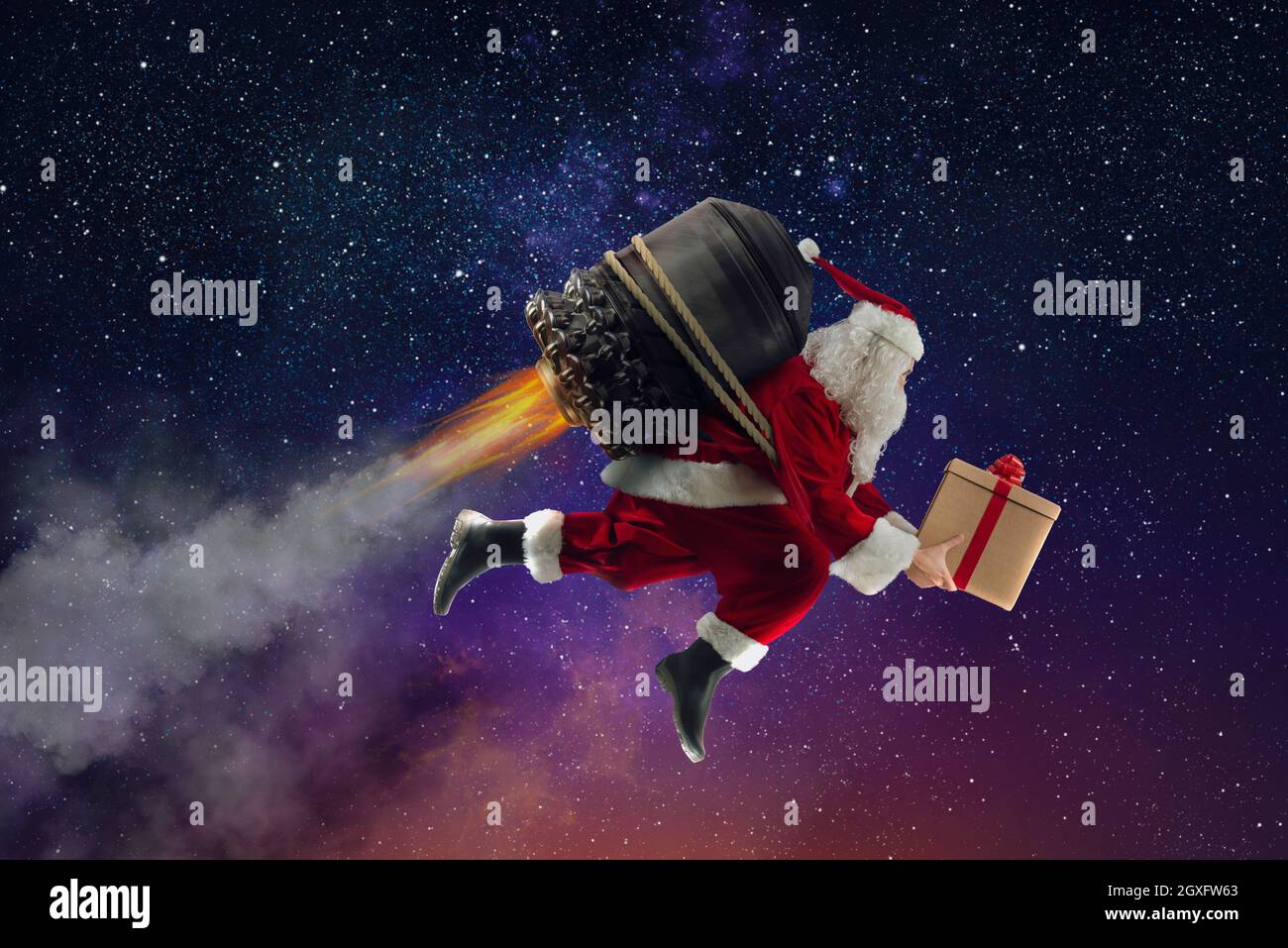 Santa Claus with gift box flies with a missile in a space Stock Photo ...