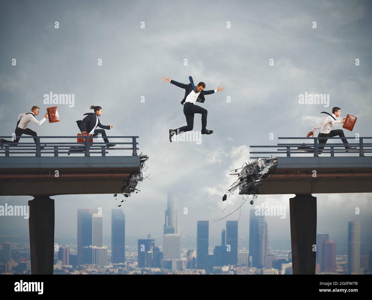 Business people overcome a broken bridge with a big jump Stock Photo ...