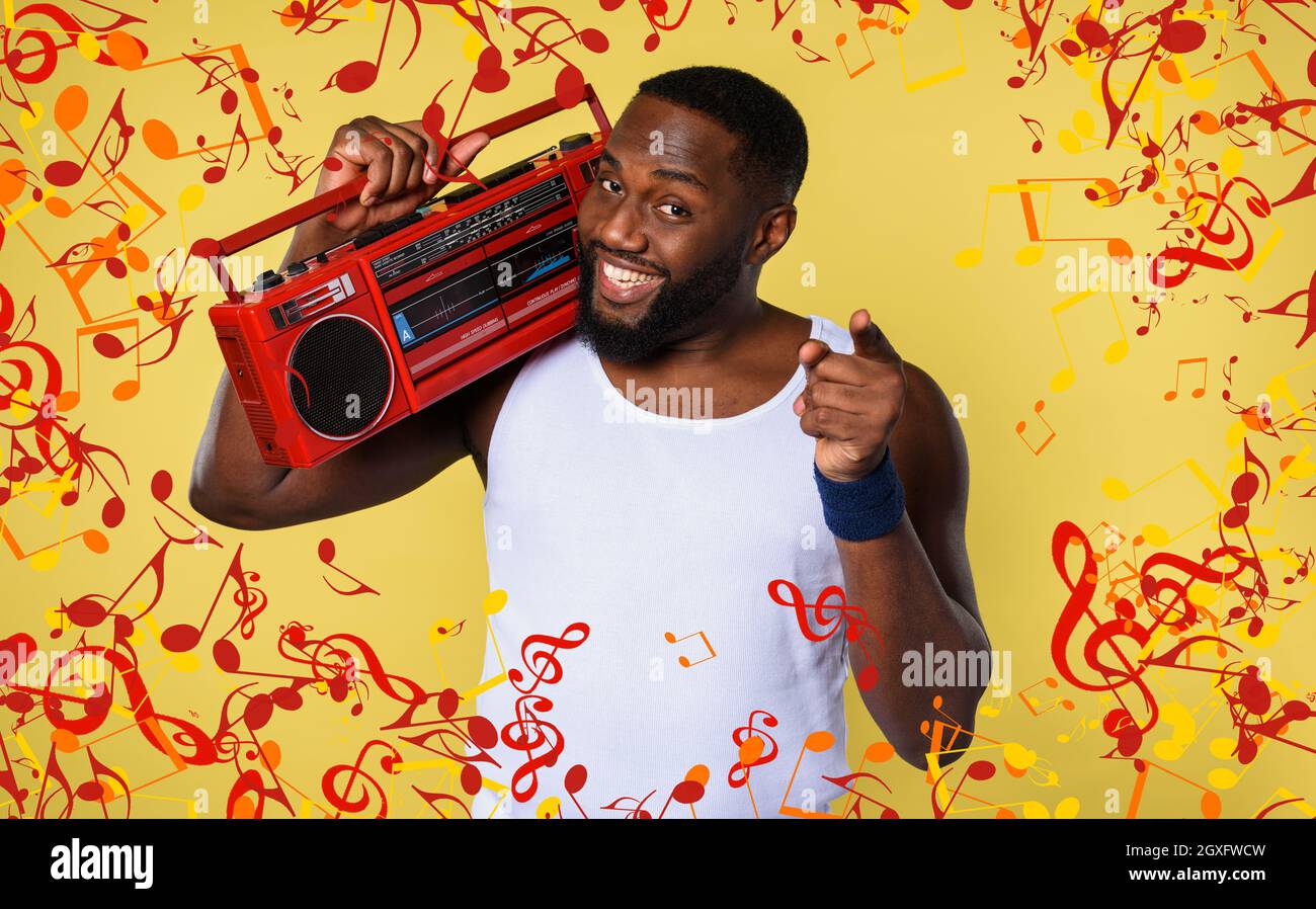 Man ears the music with an old stereo and dances. emotional and ...