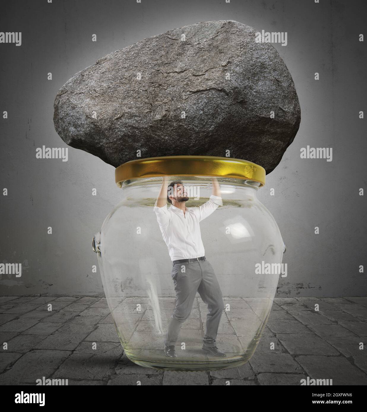 Man trapped in a jar with rock Stock Photo - Alamy
